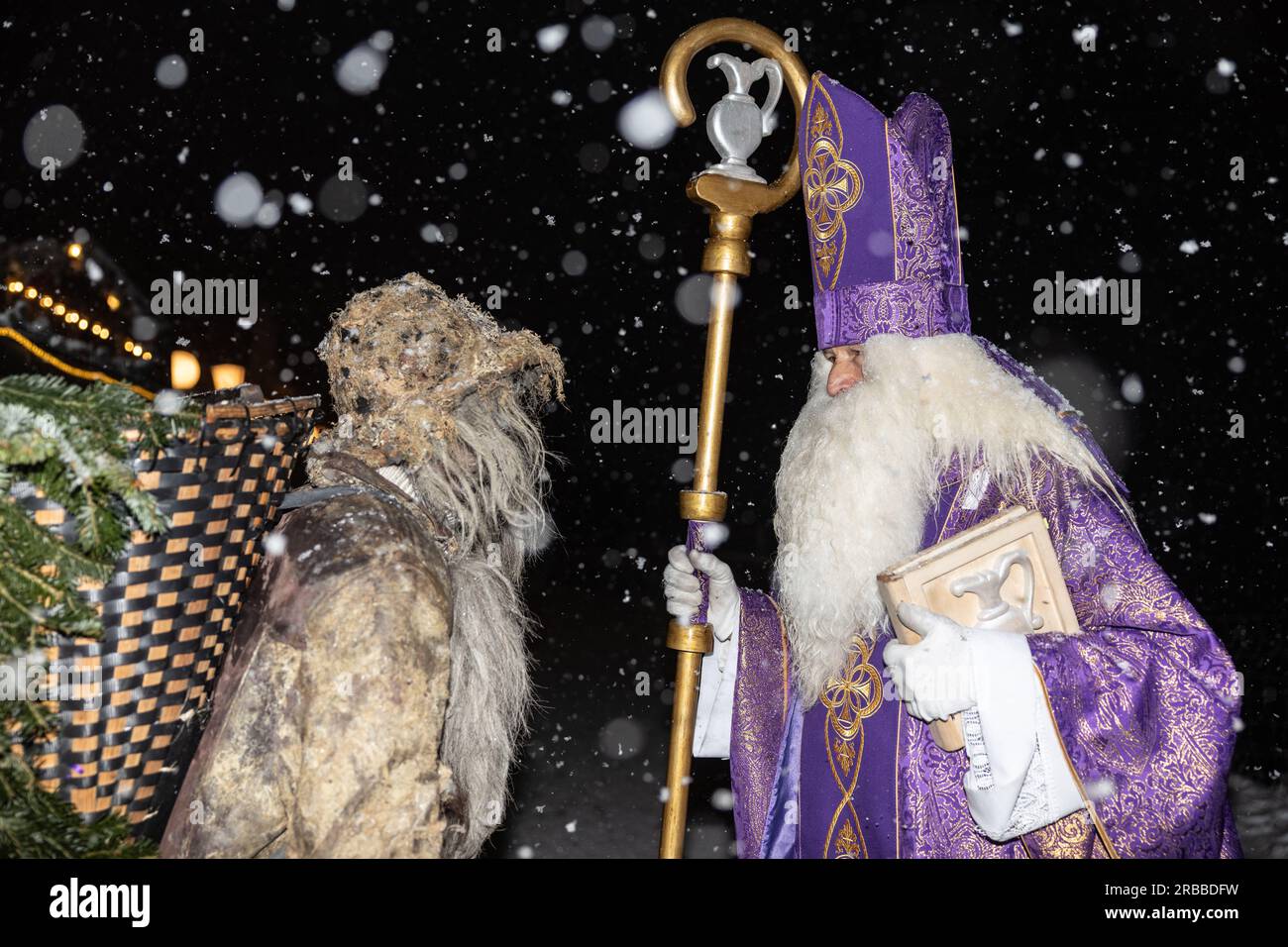 St. Nicholas and the bearer of a box with gifts in the Christmas ...