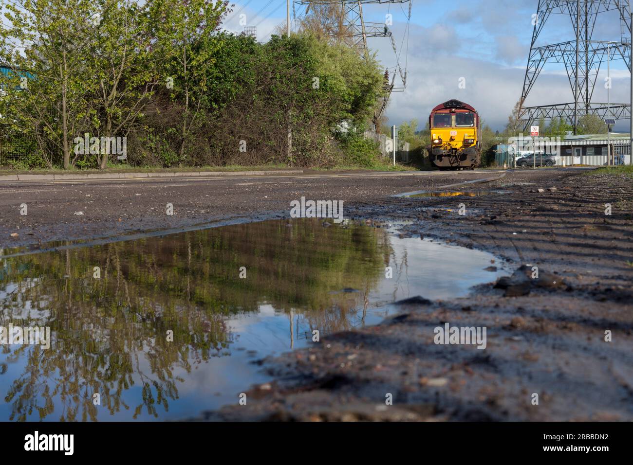 DB Cargo rail class 66 diesel locomotive 66053 hauling a freight train ...