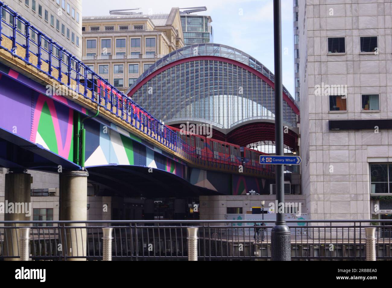 London, UK: DLR (Docklands Light Railway) train running towards Heron ...
