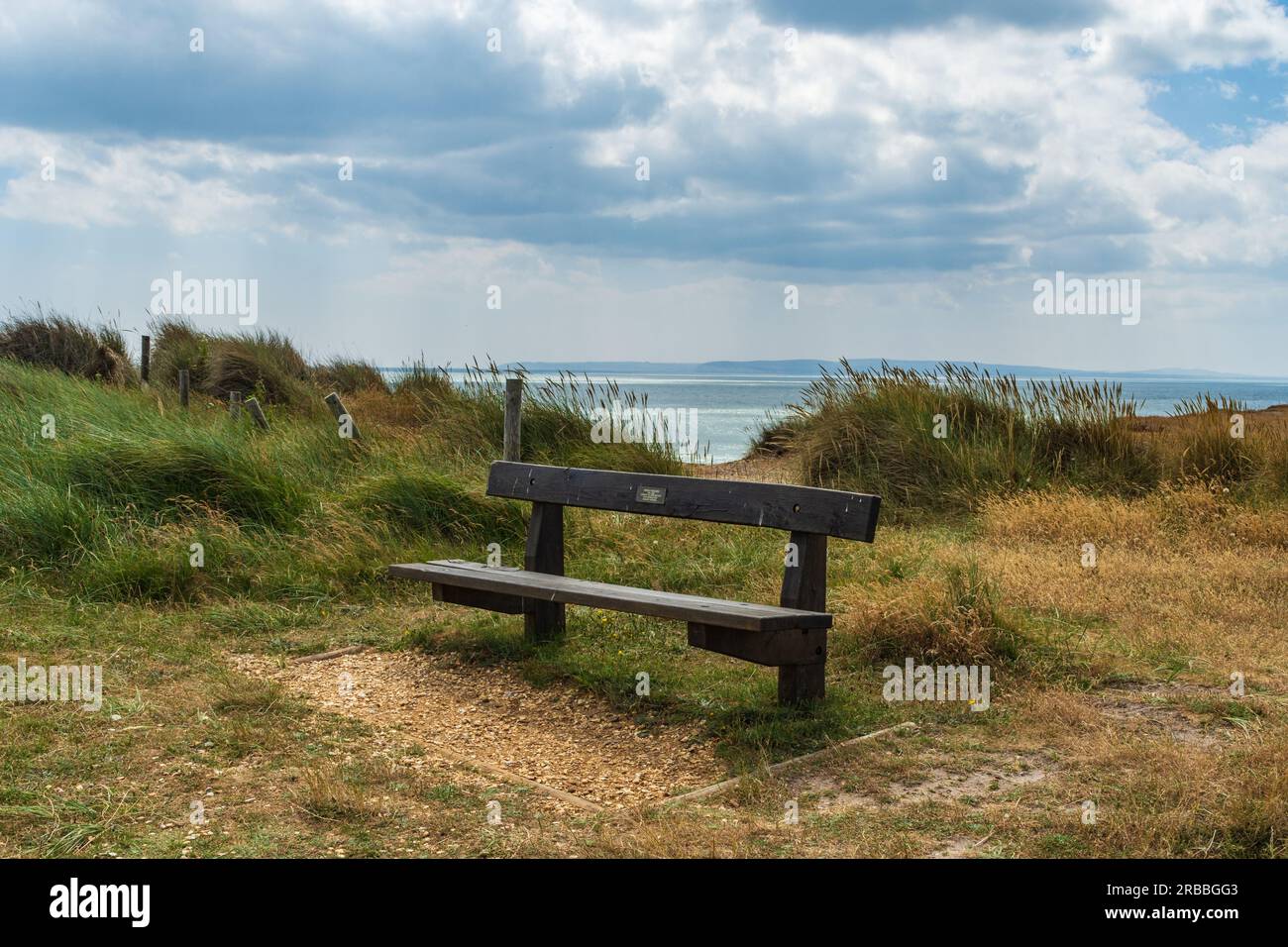 Warren Hill, Hengistbury Head, UK - July 1st 2023: Memorial bench with ...