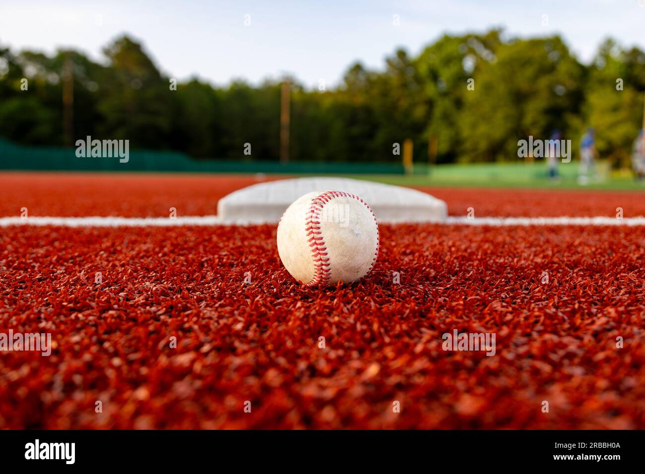 Baseball on field next to base for sports background with copy space ...