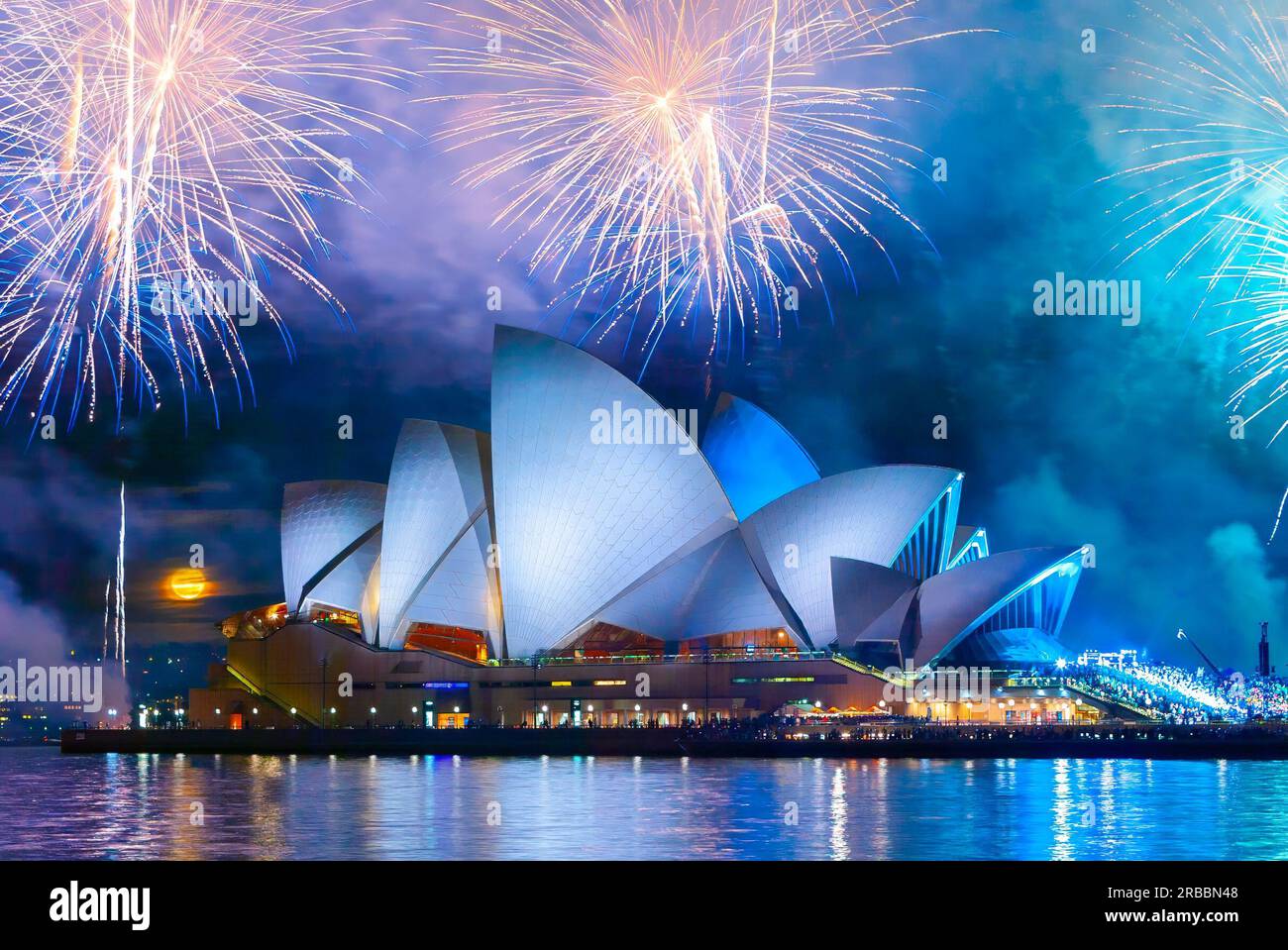 Large crowds gather to watch a fireworks show at Sydney Opera House in ...