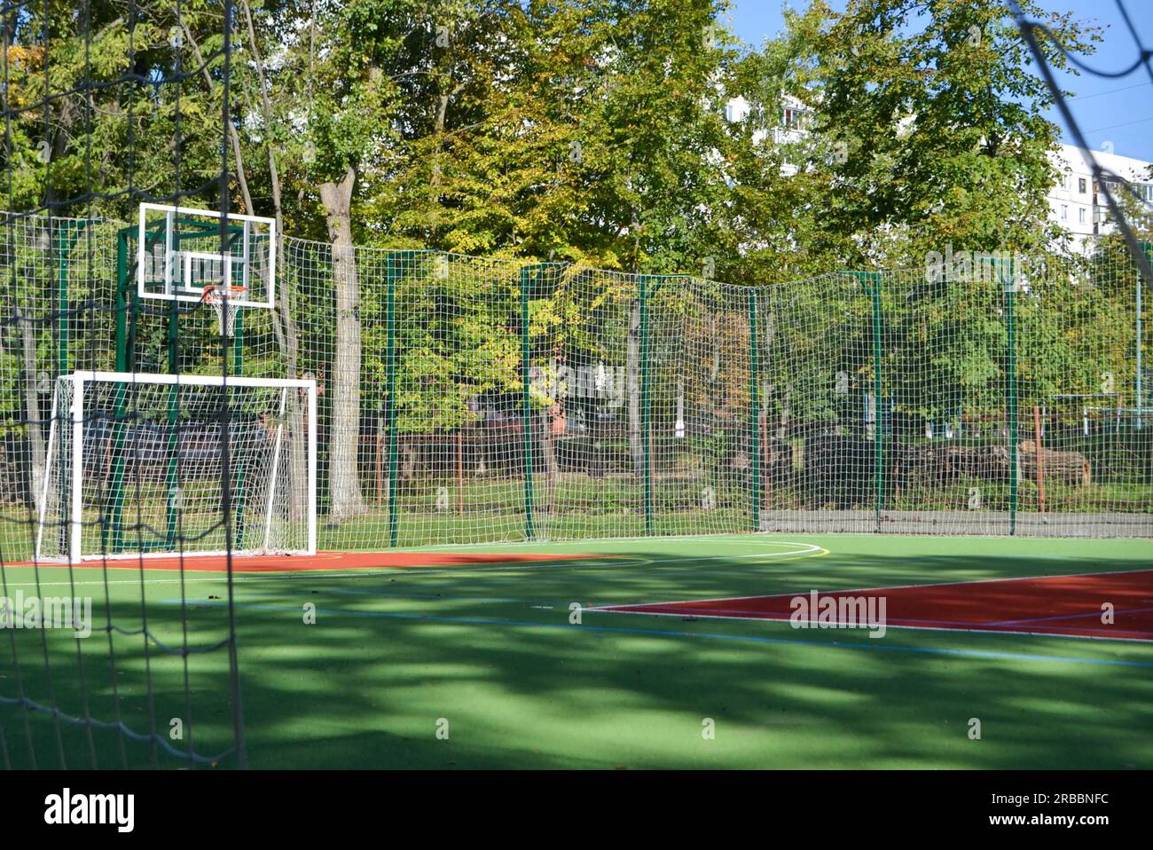 School soccer stadium. Empty soccer field behind the iron fence. High ...