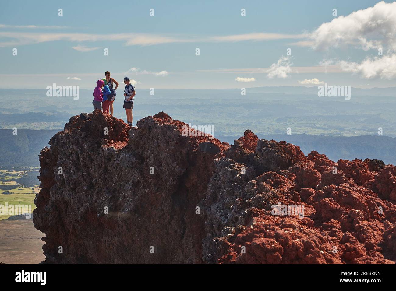 Climbing the volcano Mount Ngauruhoe, standing on the peak Stock Photo ...