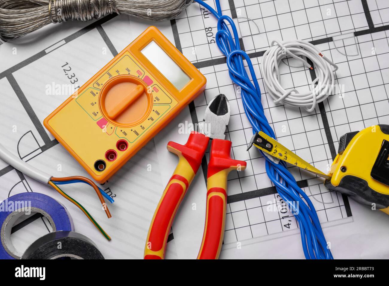 Different wires and tools on electrical schemes, top view Stock Photo ...