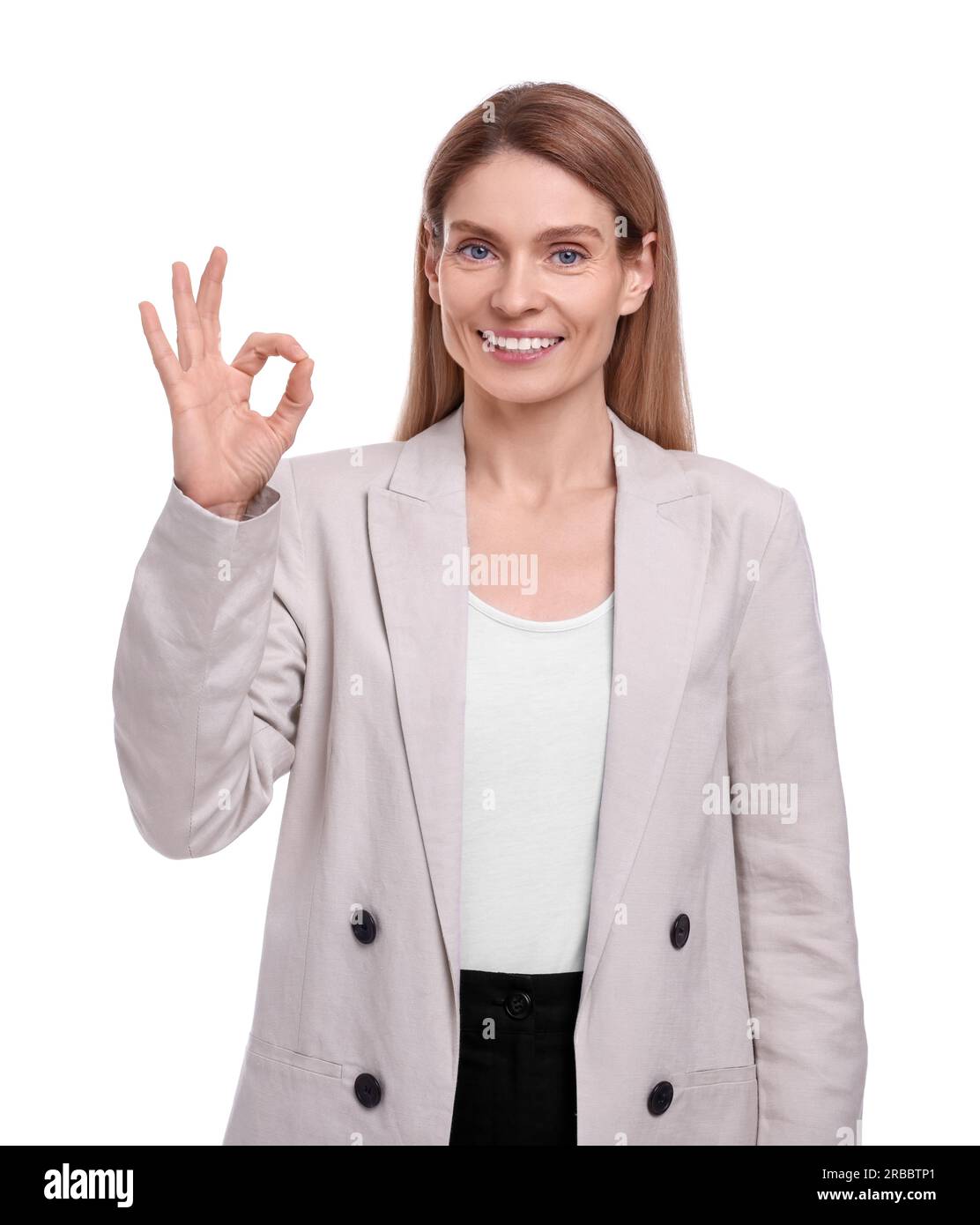 Beautiful happy businesswoman showing ok gesture on white background Stock Photo - Alamy