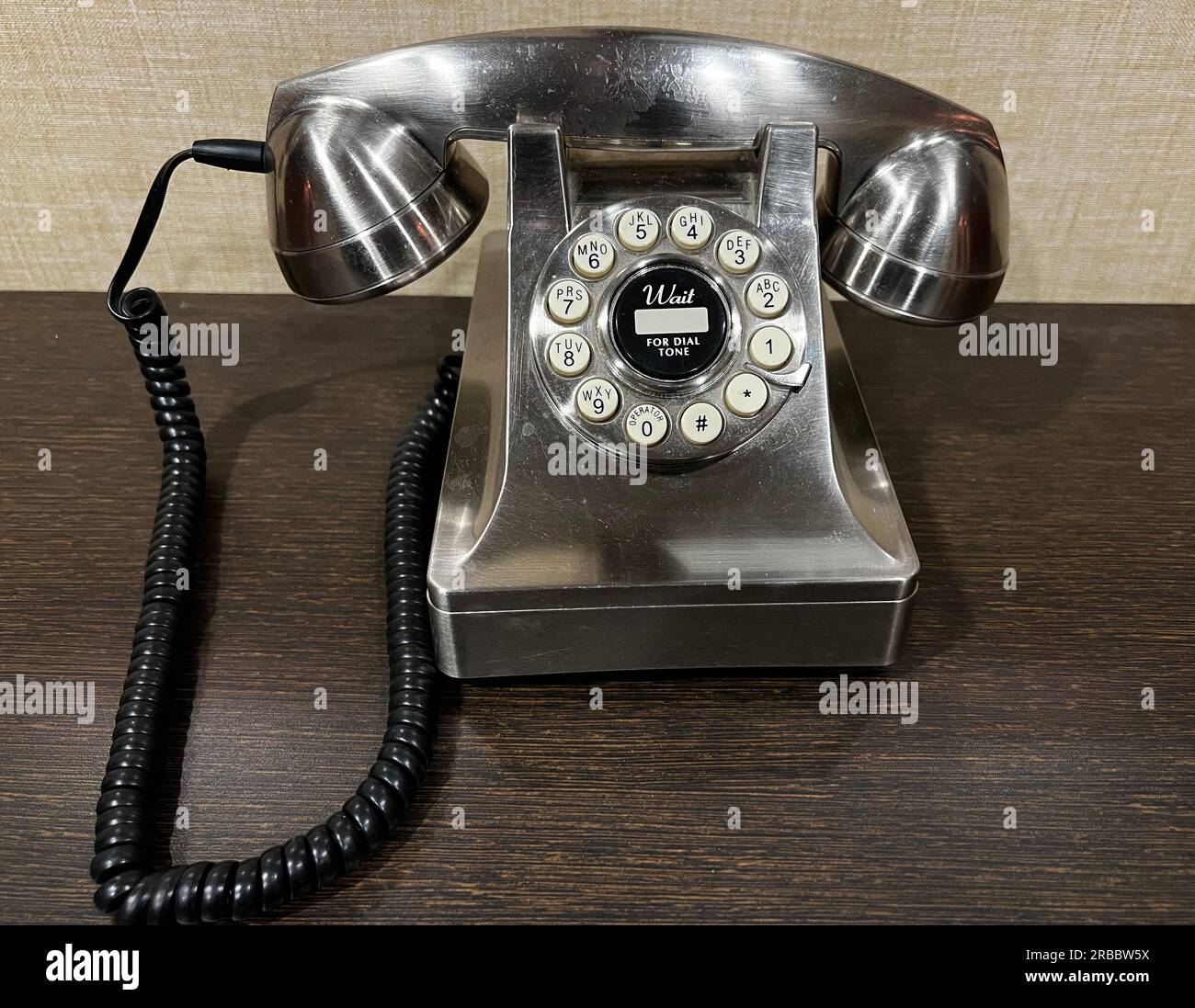 Vintage-looking brushed metal rotary dial desk telephone Stock Photo ...