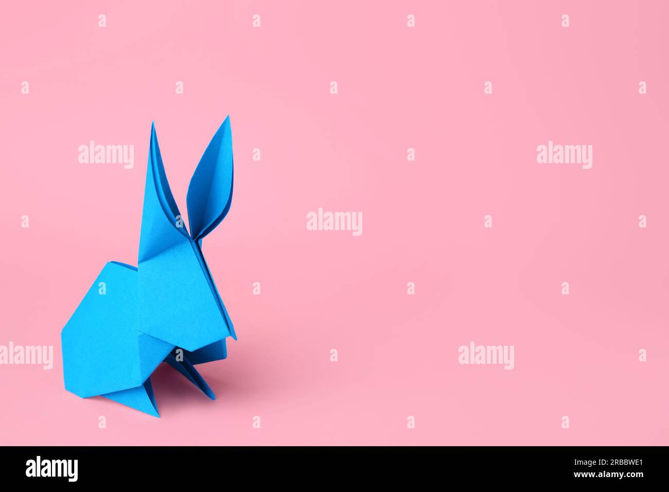 Origami art. Paper rabbit on pink background, space for text Stock ...
