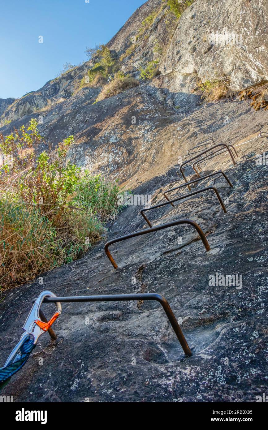 Iron Bars Ladder Bolted in Vertical Rock for Climbing Stock Photo - Alamy