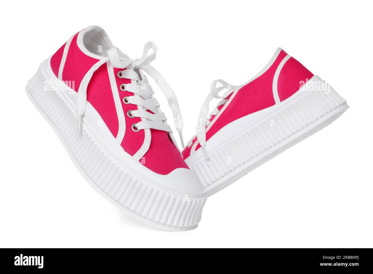 Pair of red classic old school sneakers on white background Stock Photo ...