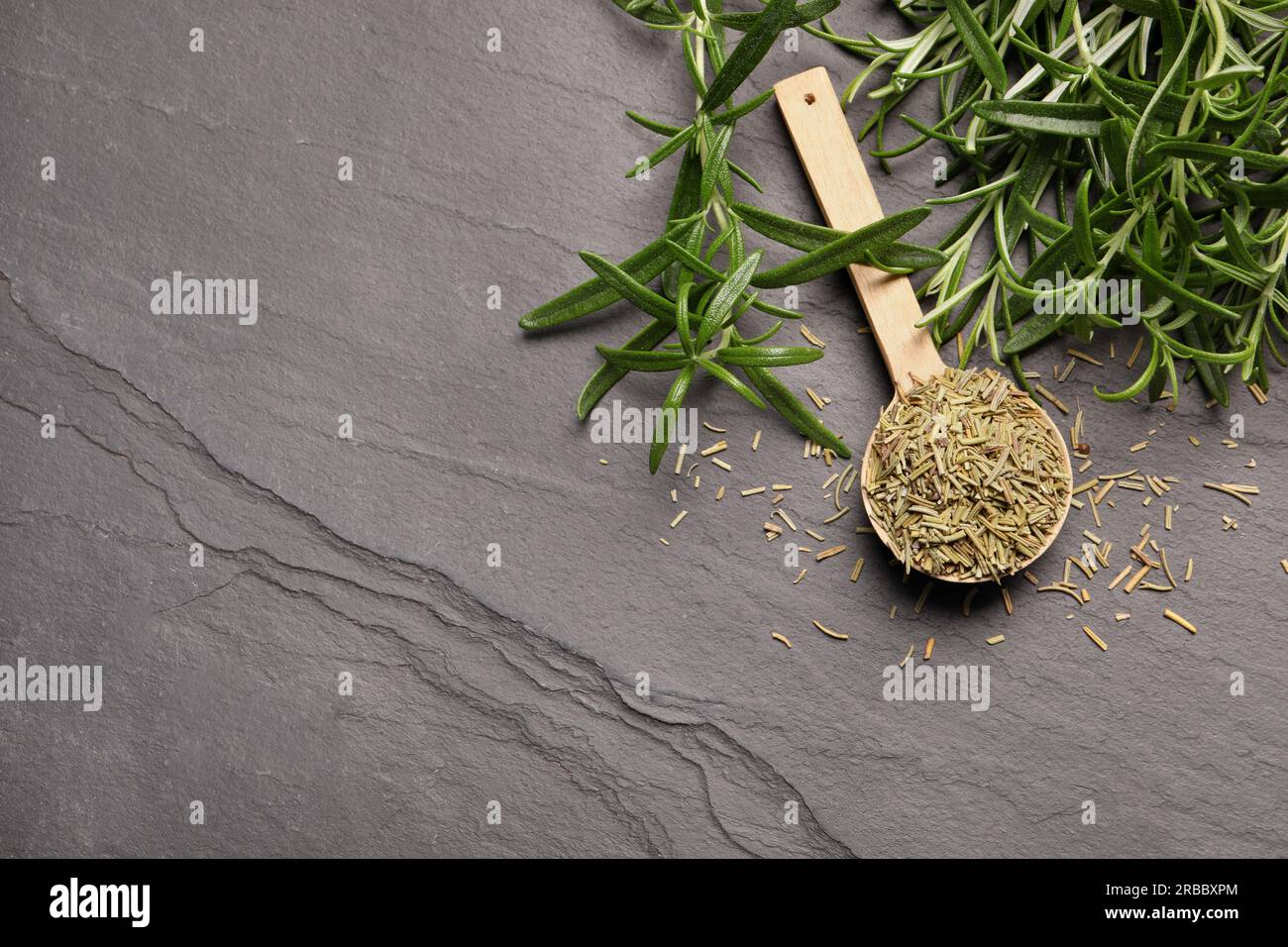 Fresh and dry rosemary on gray table, above view. Space for text Stock ...
