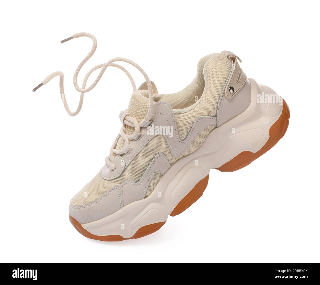 One stylish new sneaker isolated on white Stock Photo - Alamy