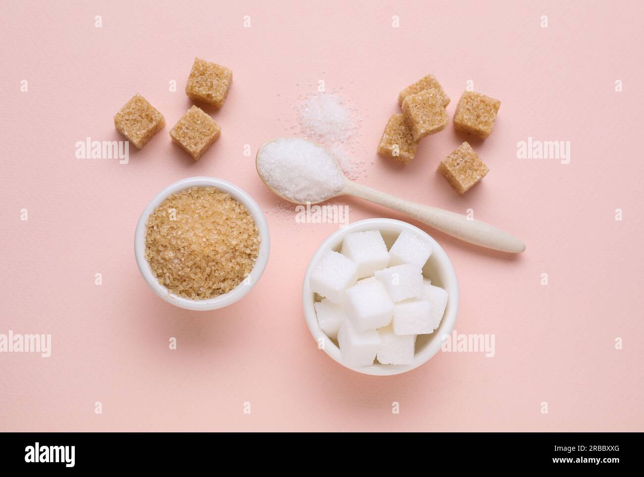 Different types of sugar on pink background, flat lay Stock Photo - Alamy