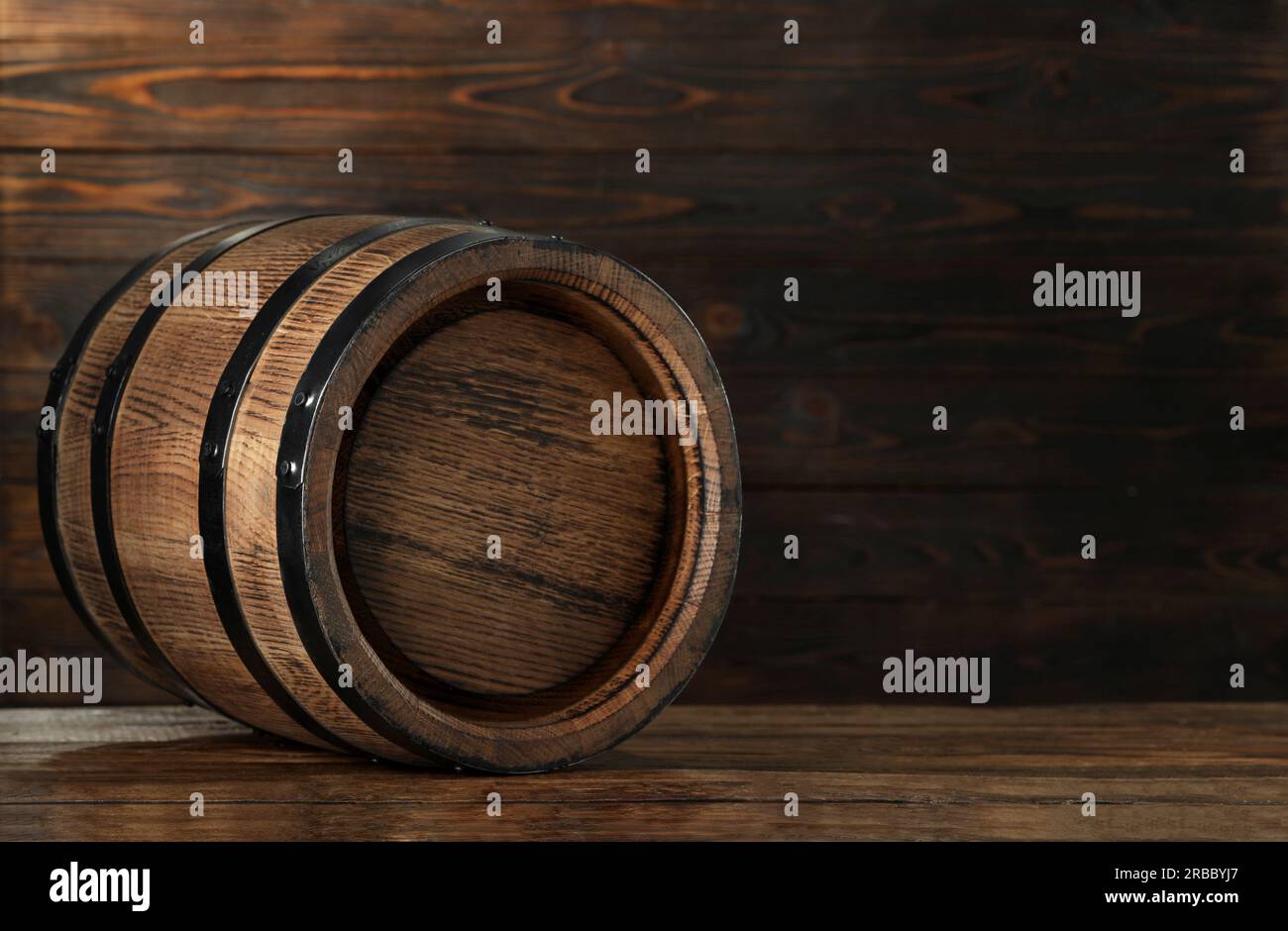 Wooden barrel on table, space for text Stock Photo - Alamy