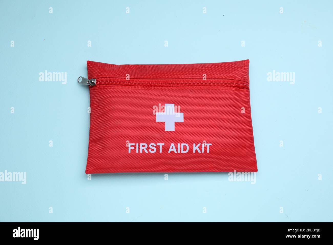 First aid kit on light blue background, top view Stock Photo - Alamy