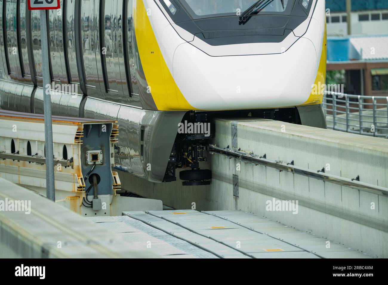 Elevated monorail train on rail. Guide wheels rubber tire on concrete ...