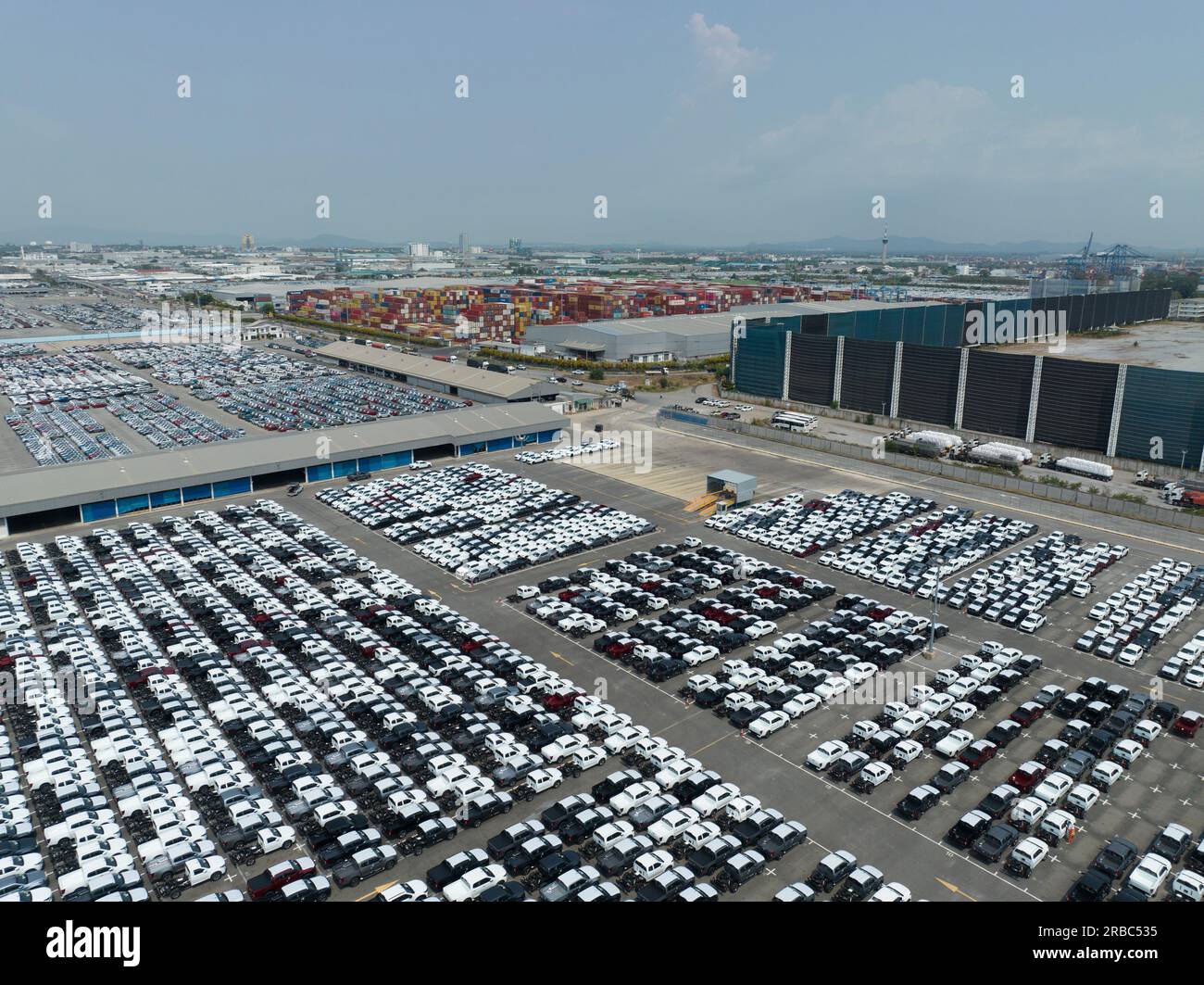 Aerial view of new cars stock at factory parking lot. Above view cars ...