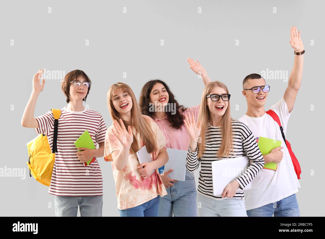 Group of students on light background Stock Photo - Alamy