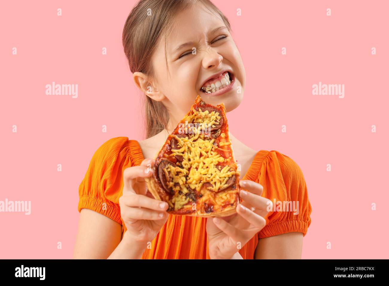 Angry little girl eating tasty pizza on pink background, closeup Stock ...