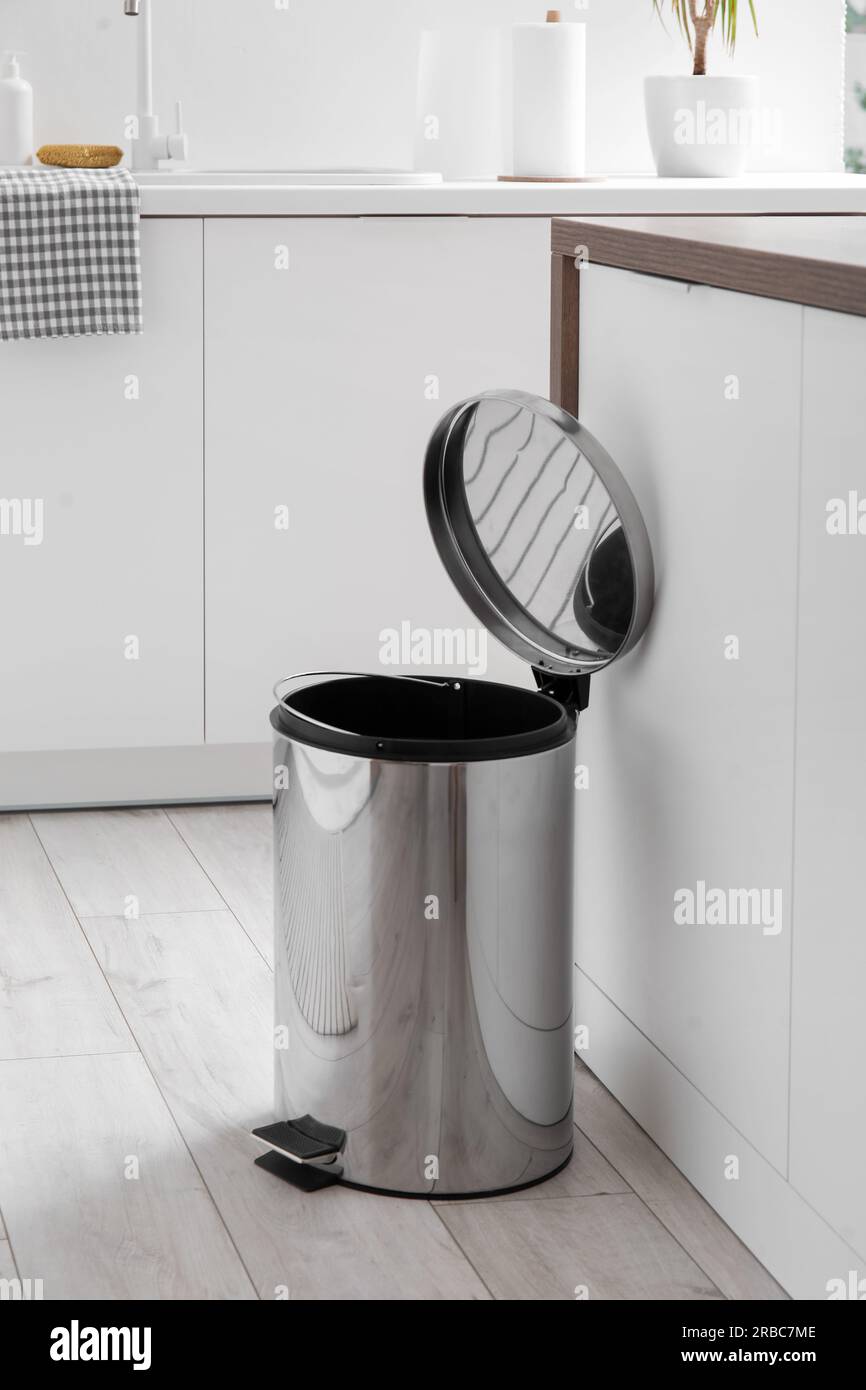 Opened trash bin in interior of light kitchen Stock Photo - Alamy