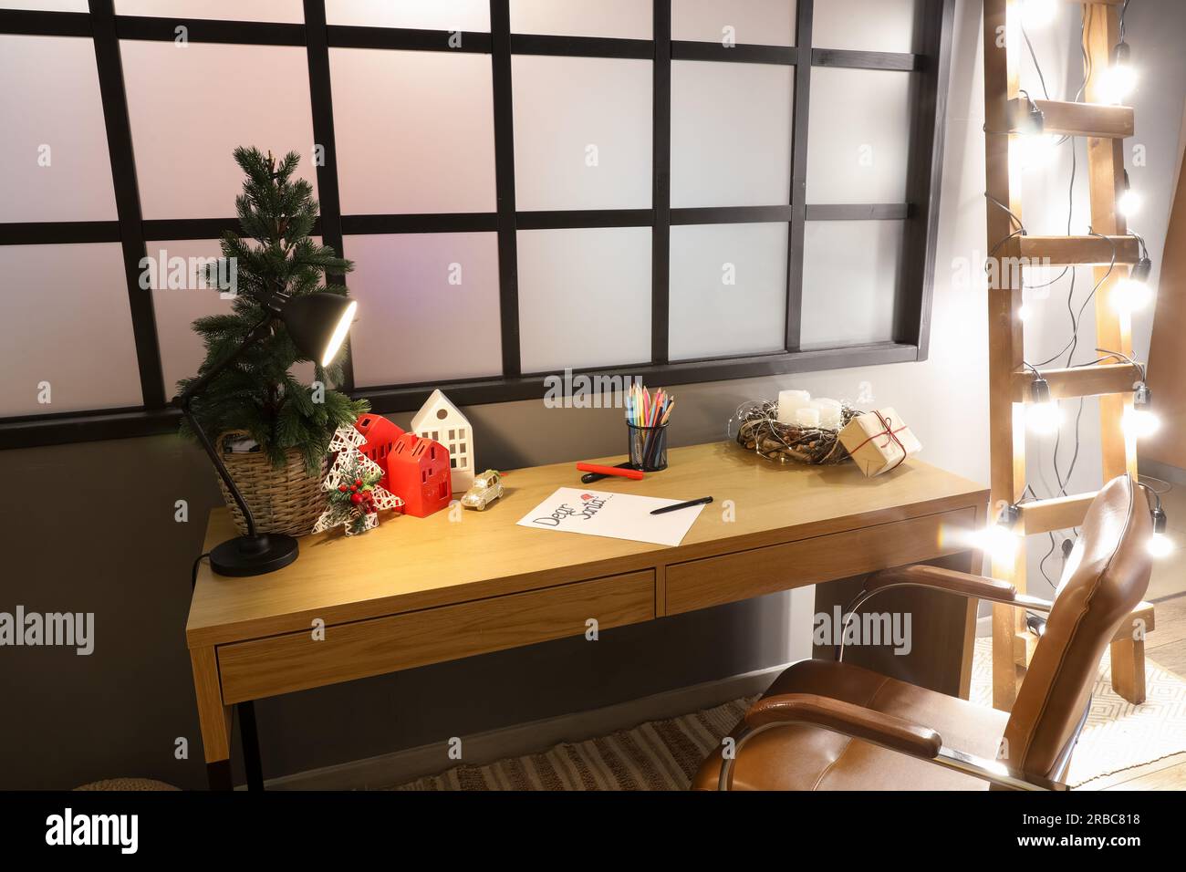 Home office desk with Christmas tree and decorations Stock Photo - Alamy