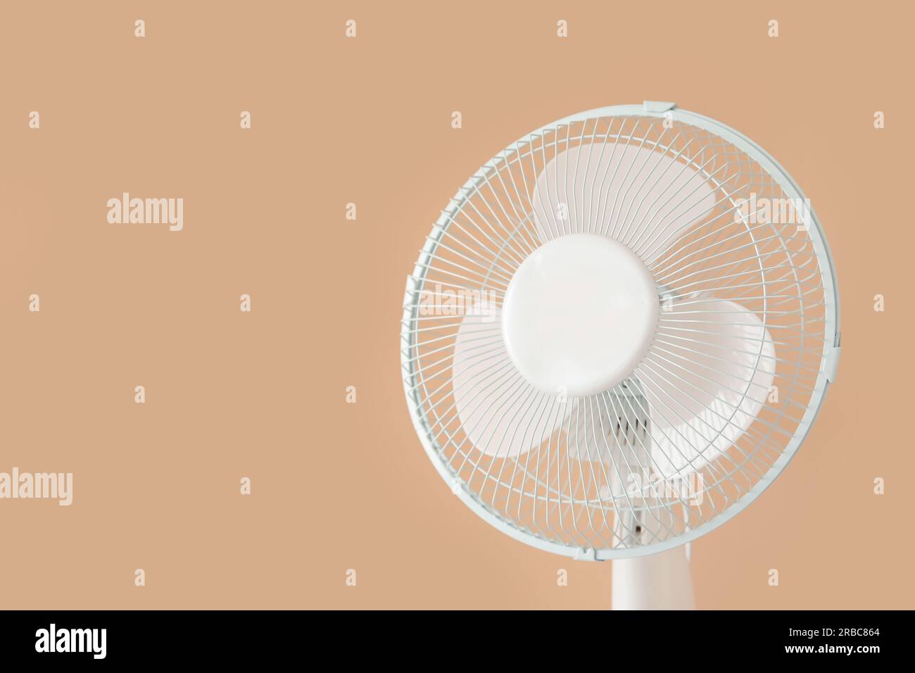 Modern electric fan on beige background Stock Photo - Alamy
