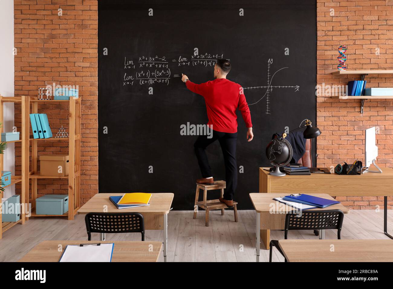 Lecturer university writing equation hi-res stock photography and ...