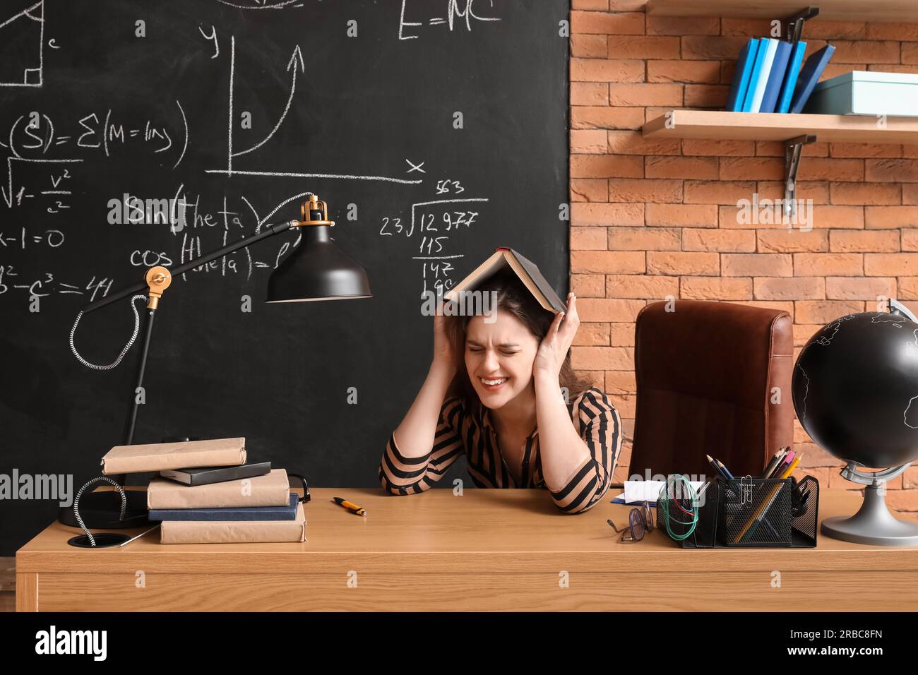 Stressed teacher portrait blackboard hi-res stock photography and ...
