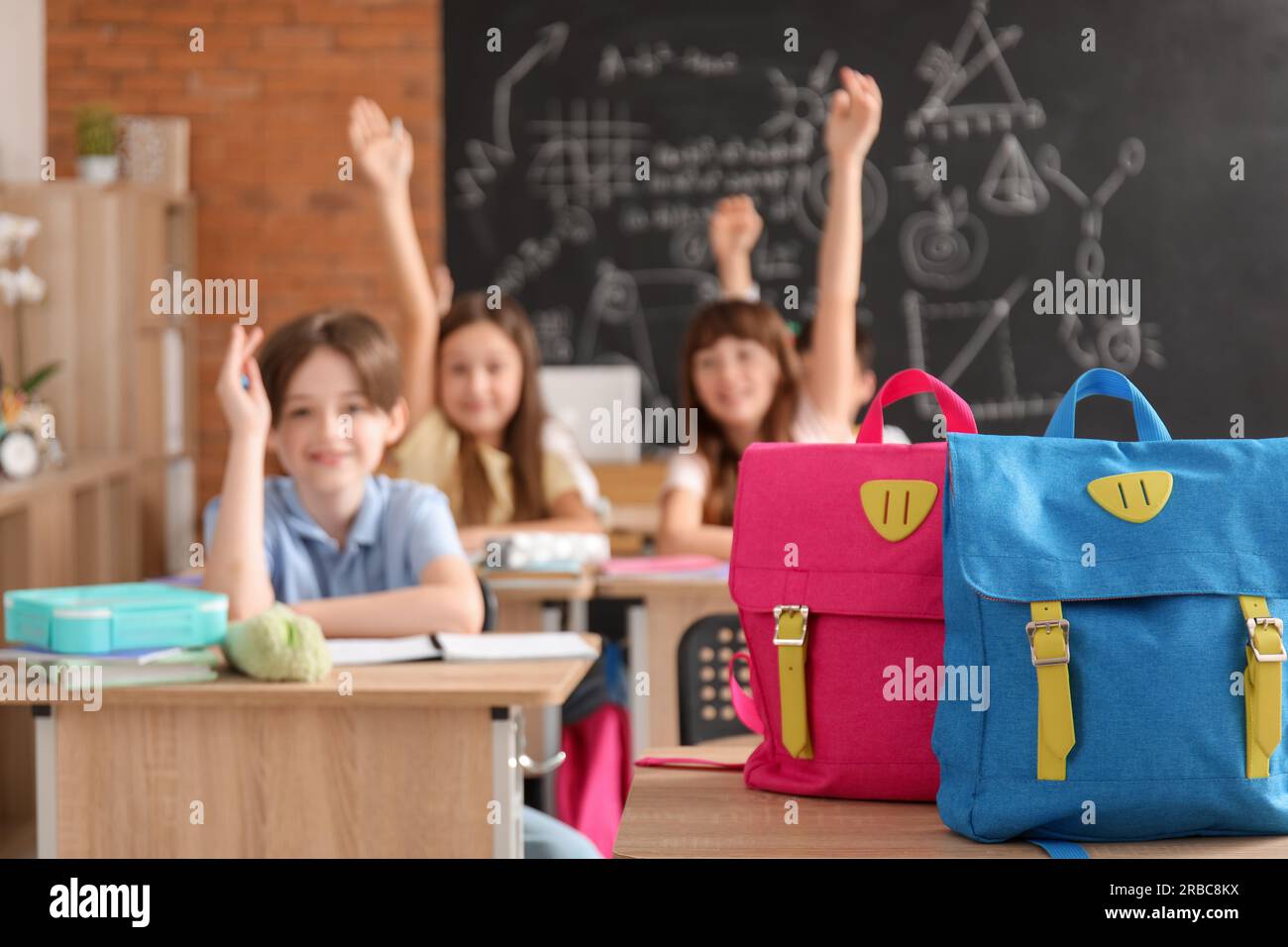 Children backpacks classroom table hi-res stock photography and images ...