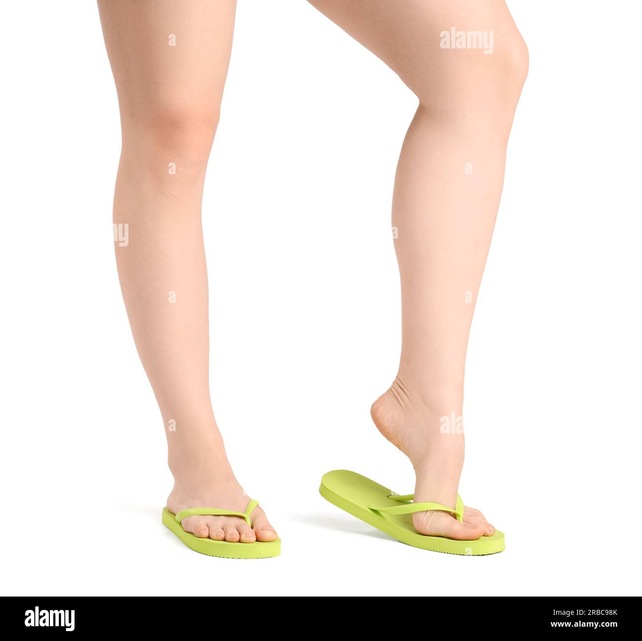 Female legs in flip-flops on white background Stock Photo - Alamy