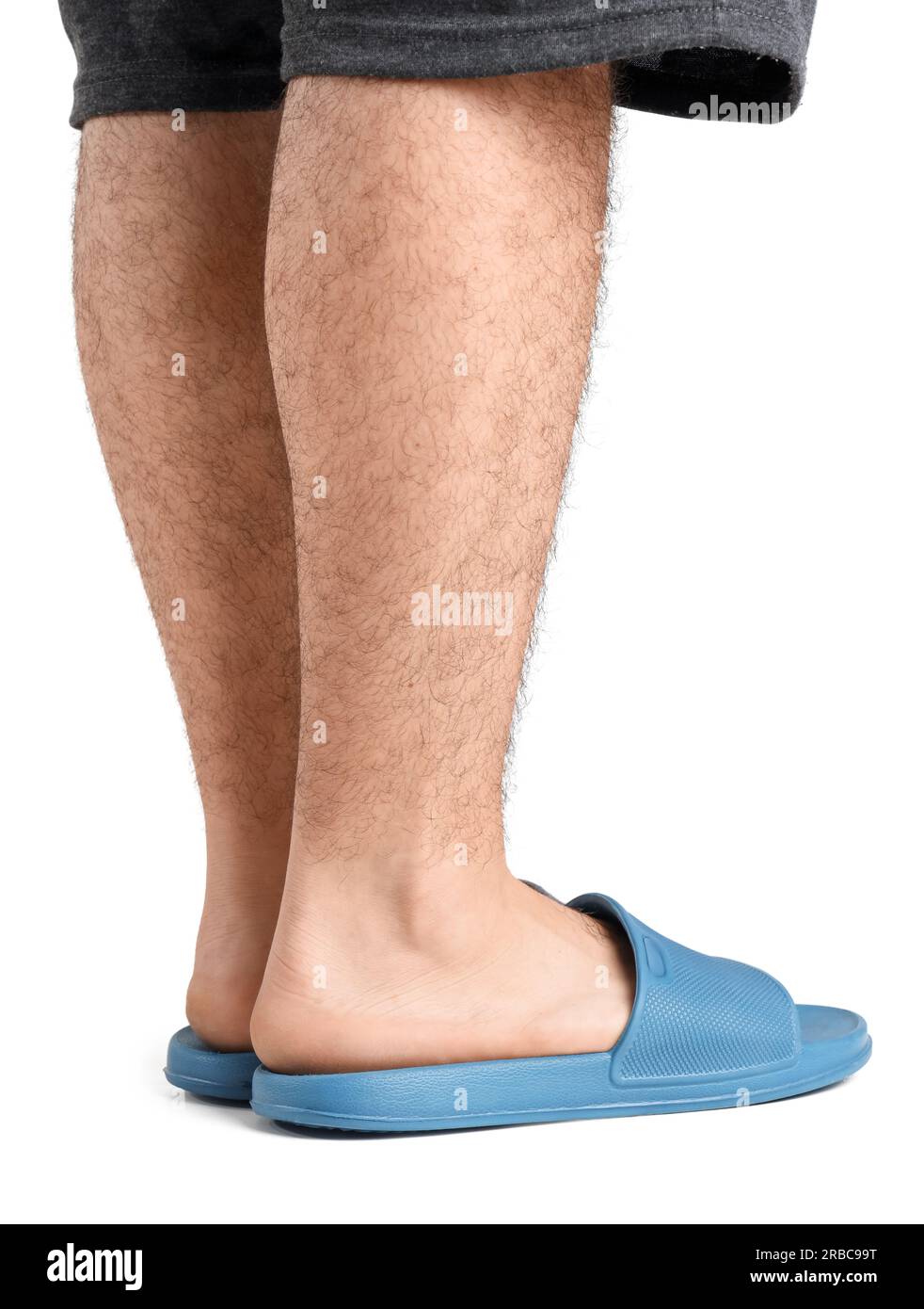 Male legs in flip-flops on white background Stock Photo - Alamy