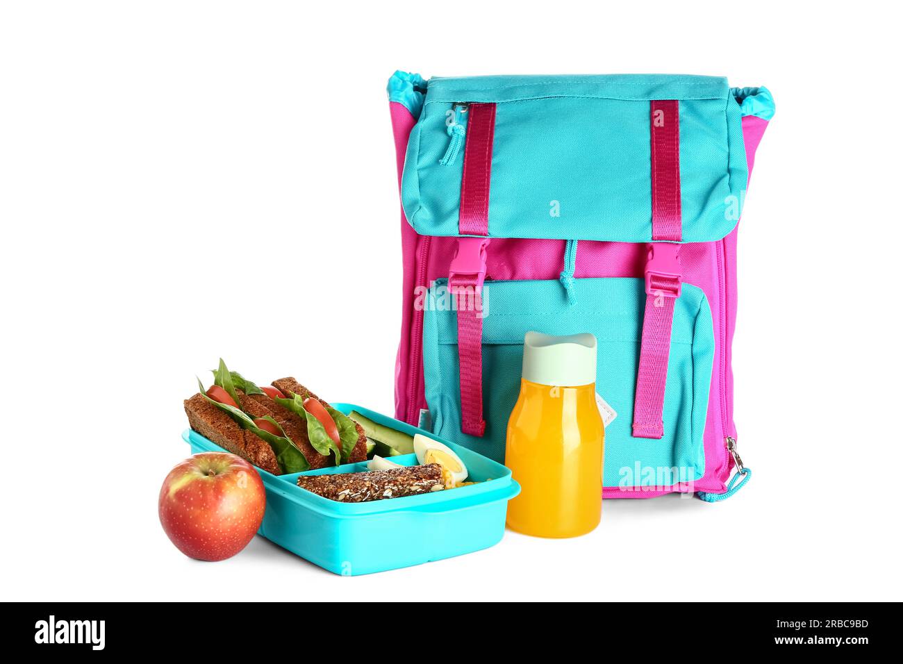 Backpack, drink and lunchbox with tasty food isolated on white ...