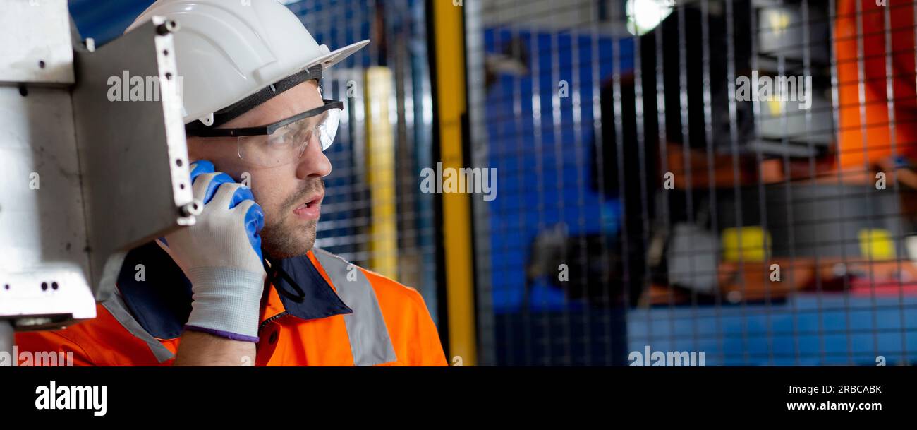 Young caucasian engineer man inspection robot arms technology ...