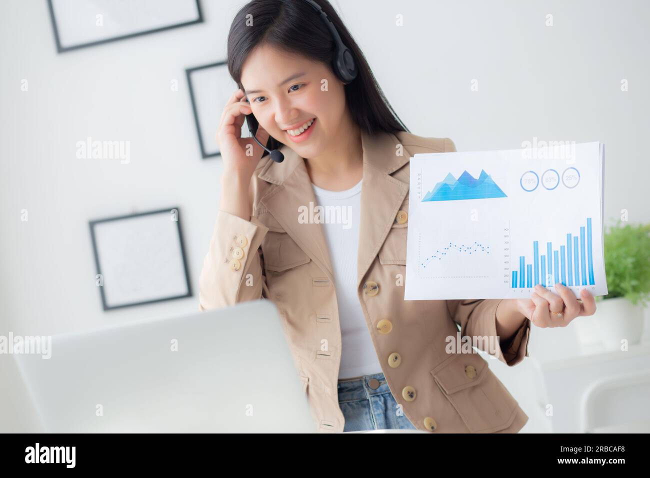 Young asian business woman using laptop computer for video conference ...