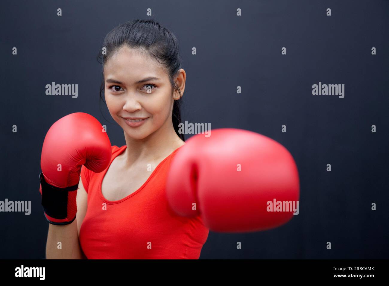 Determination of young asian woman having motivation boxing in fitness ...