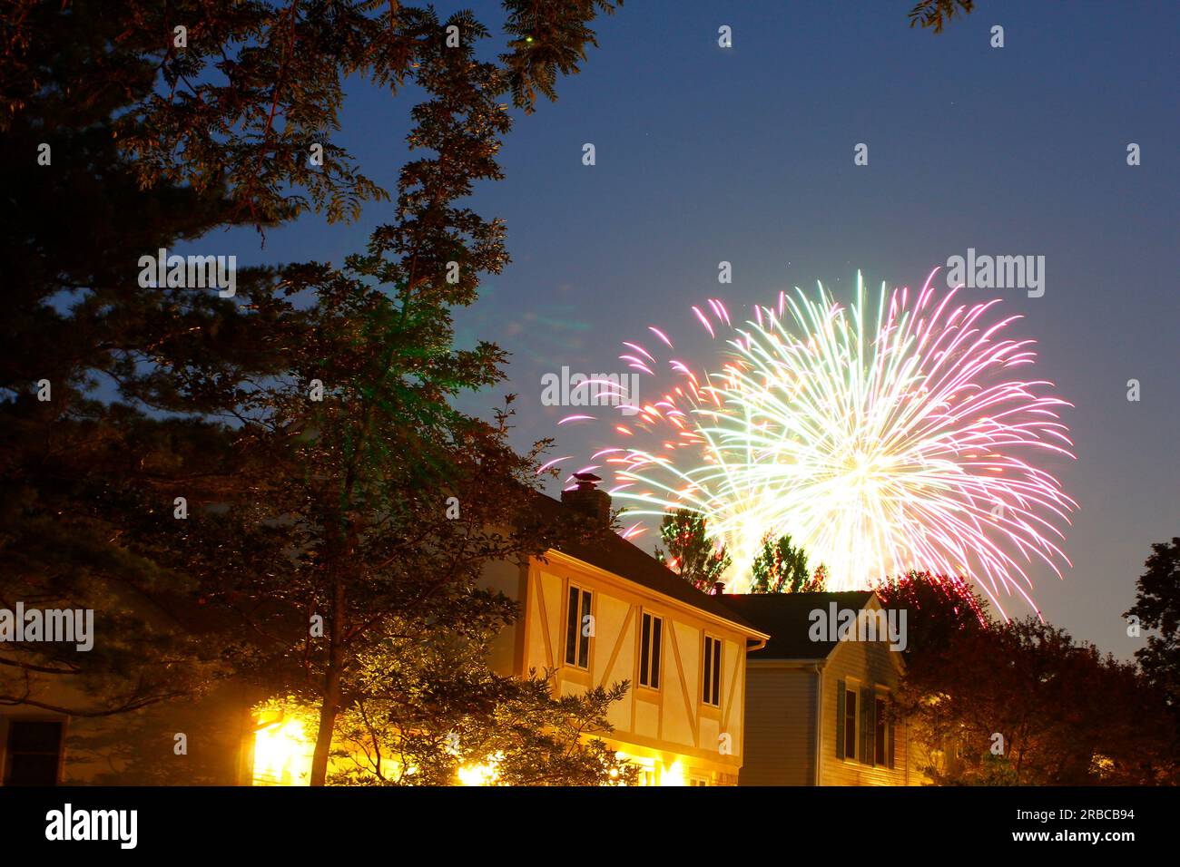 Fireworks Seen Over Houses in a Neighborhood Stock Photo - Alamy