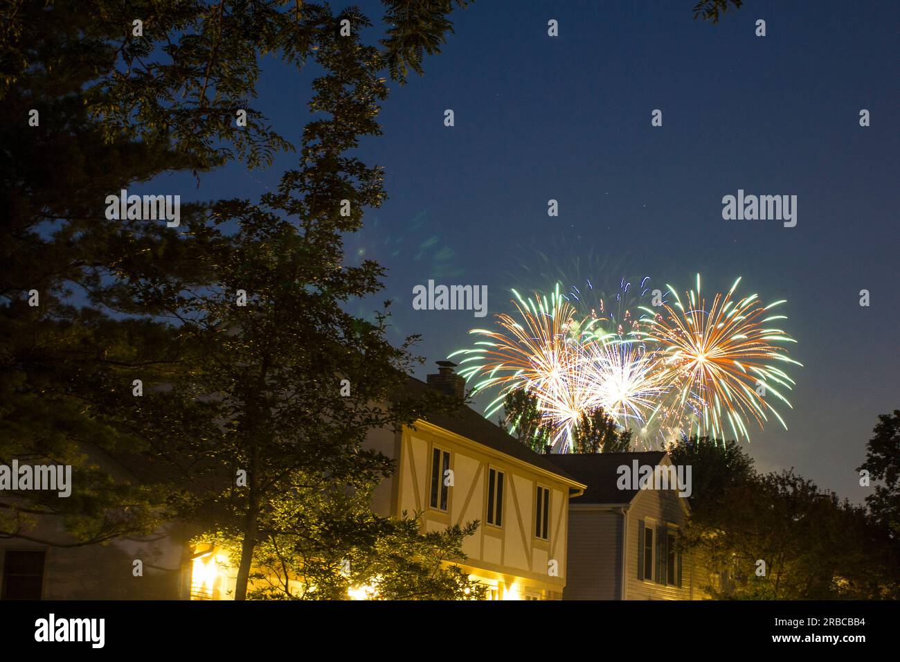 Fireworks Seen Over Houses in a Neighborhood Stock Photo - Alamy