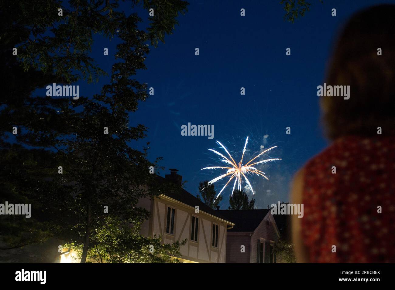 Fireworks Seen Over Houses in a Neighborhood Stock Photo - Alamy
