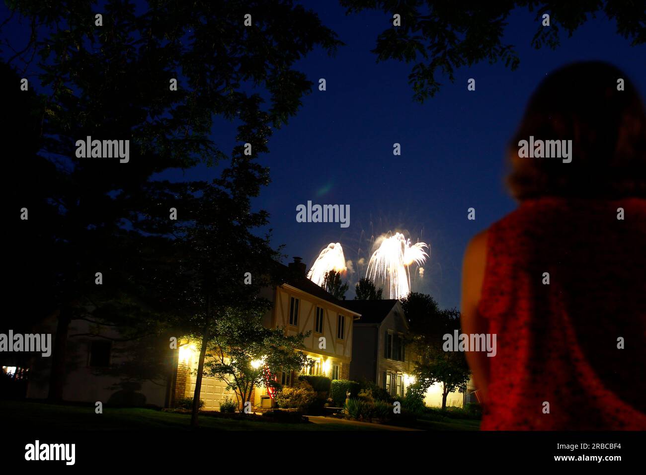 Fireworks Seen Over Houses in a Neighborhood Stock Photo - Alamy