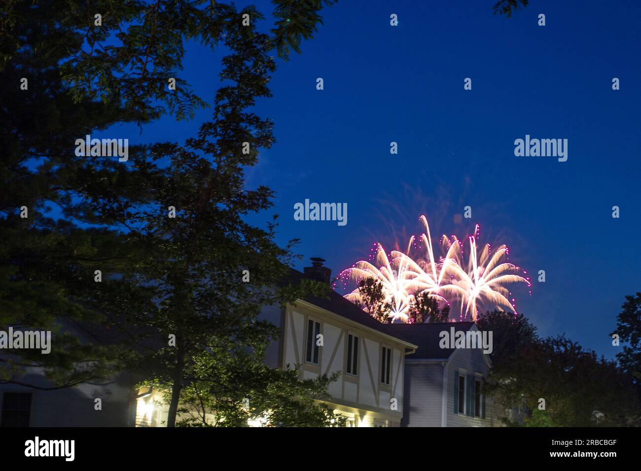 Firework display over houses in hi-res stock photography and images - Alamy