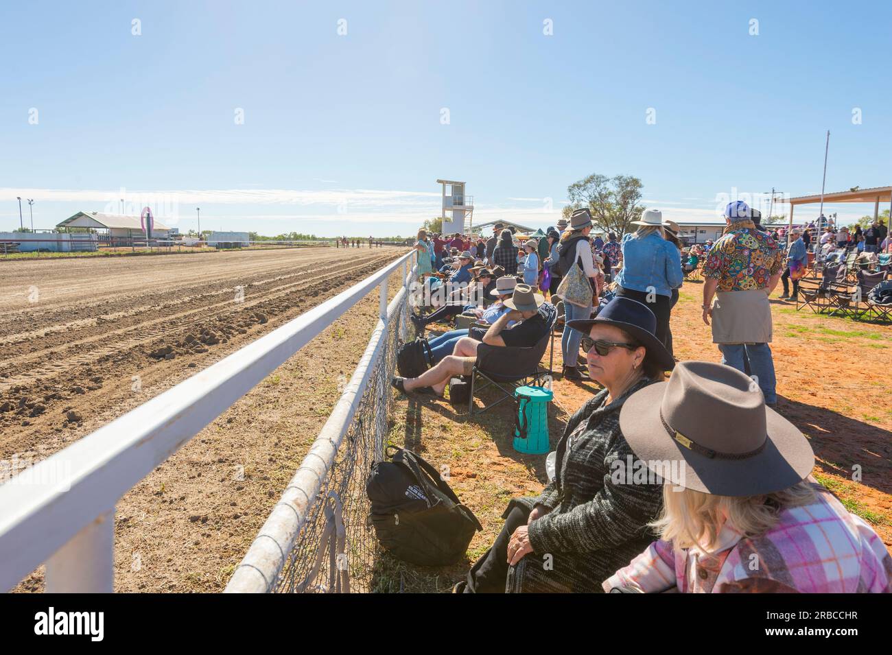 Spectators along the racecourse waiting for the Bedourie Camel Race to ...