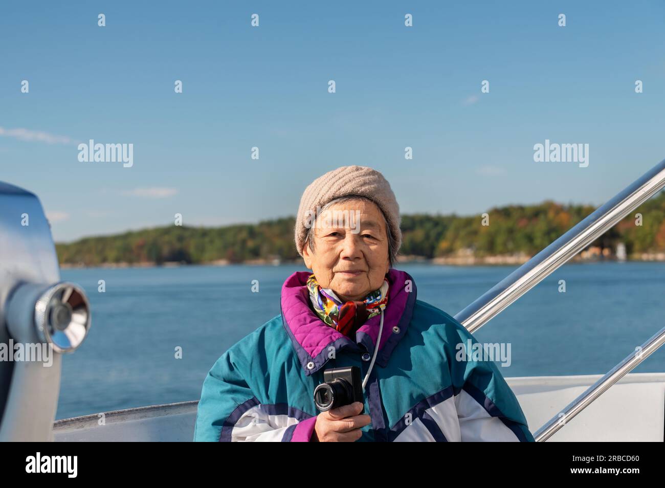 Senior Chinese tourist on cruise ship on Saint Lawrence river. Thousand ...