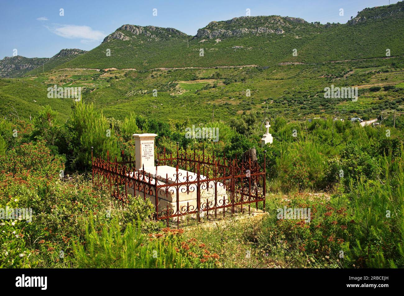 Grave with tombstone on the top of a hill Stock Photo - Alamy