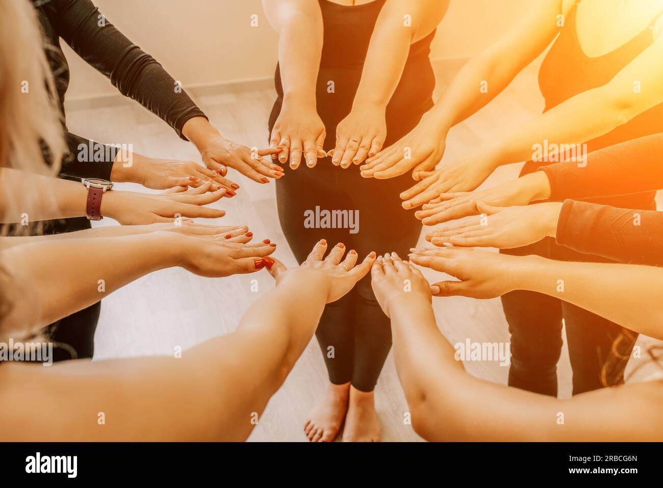 Partnership and unity concept: unrecognizable women in sportswear ...