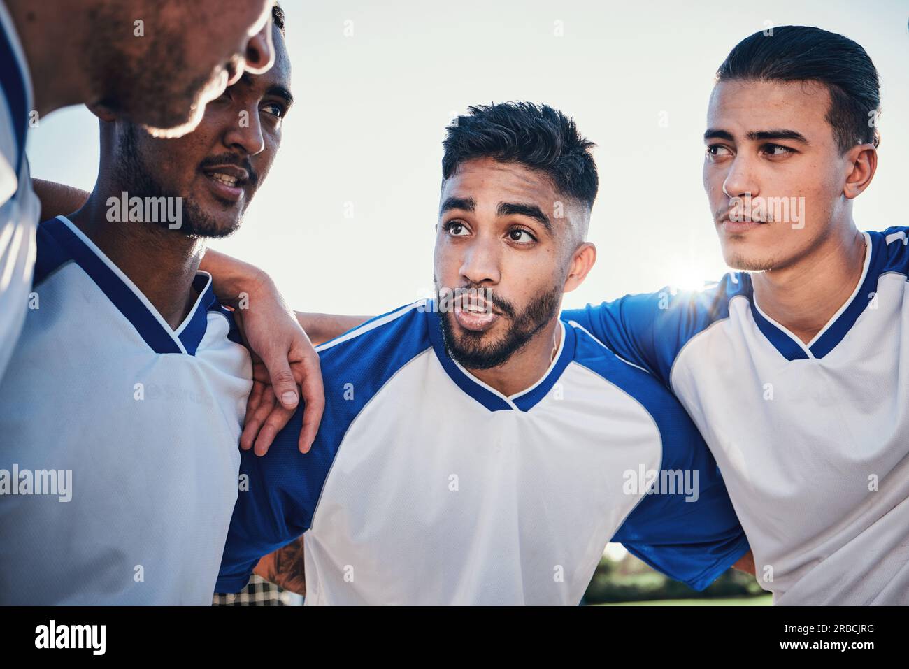 Motivation, football and team captain talking in a huddle planning ...