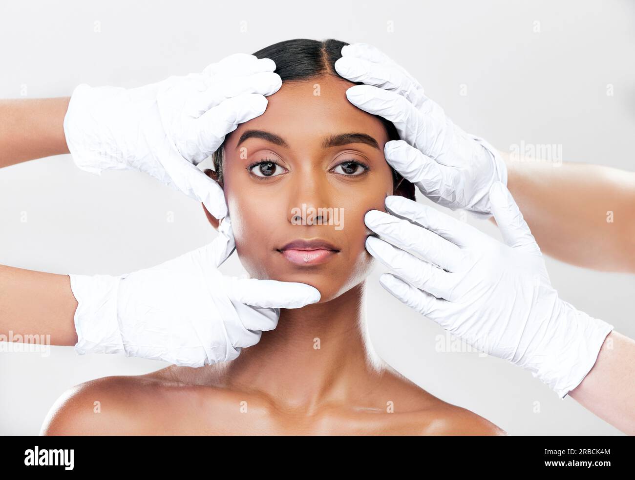 Woman, plastic surgery and hands in studio portrait with beauty ...