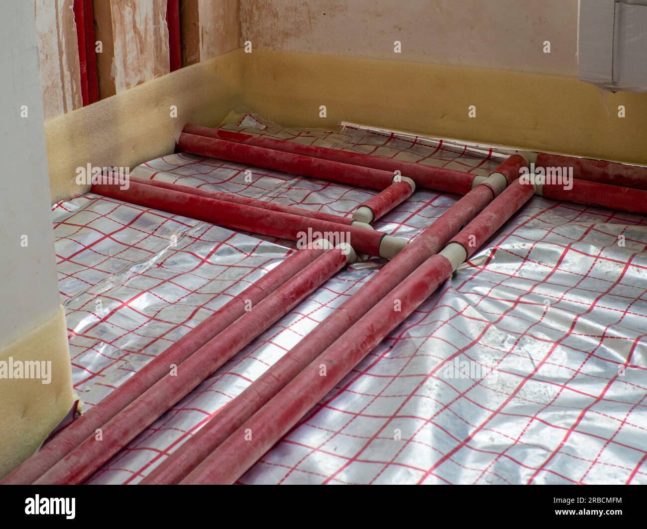Installing heating and water pipes in apartment Stock Photo - Alamy