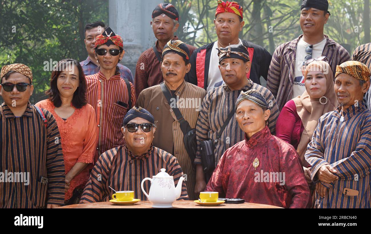 People with Javanese traditional cloth drink coffee Stock Photo - Alamy