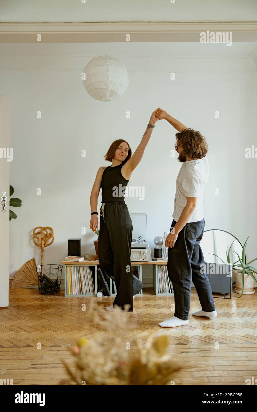 Lovely young couple dancing together at home. Romantic family time ...