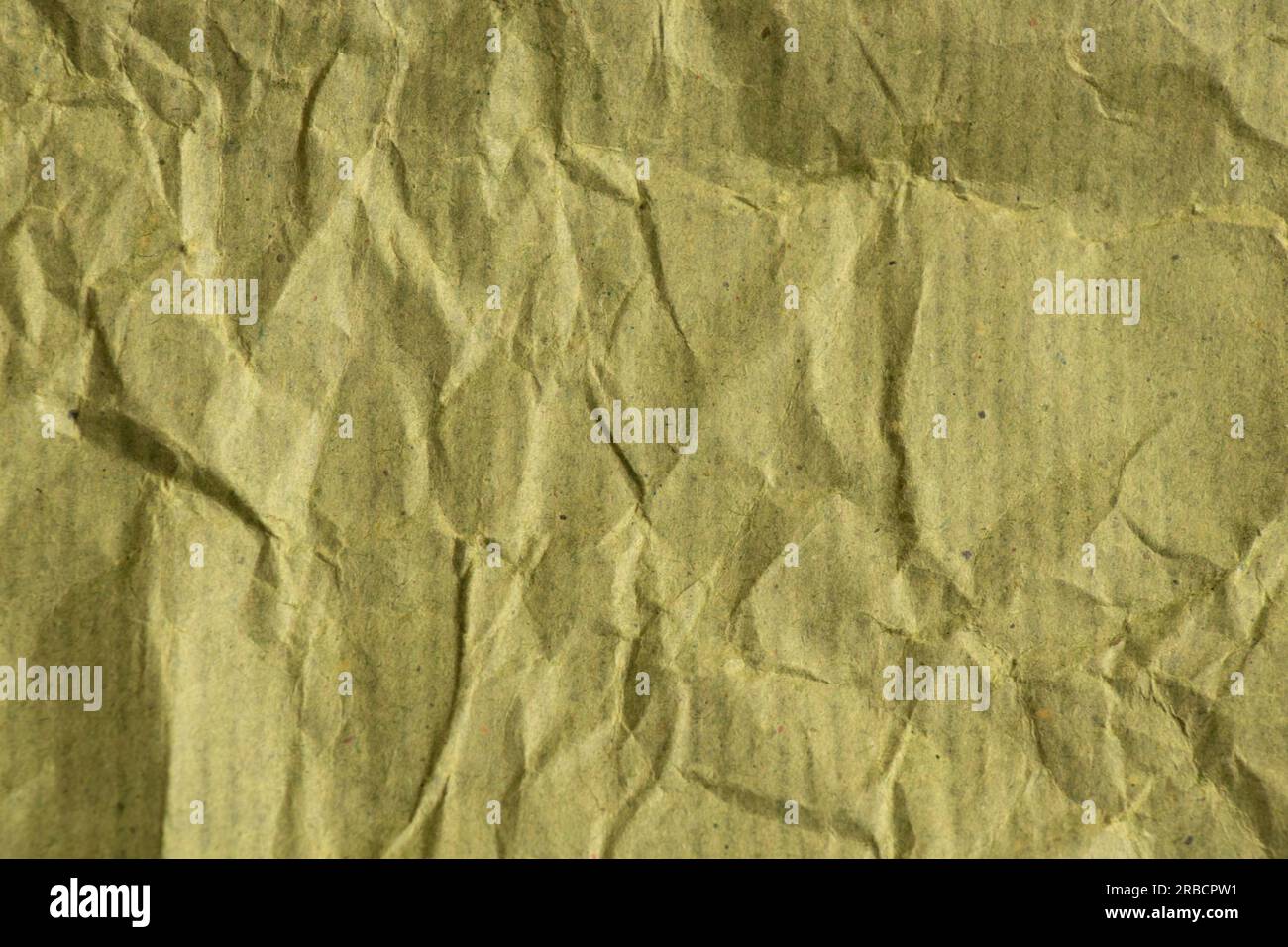 green plain paper crumpled closeup as background Stock Photo - Alamy